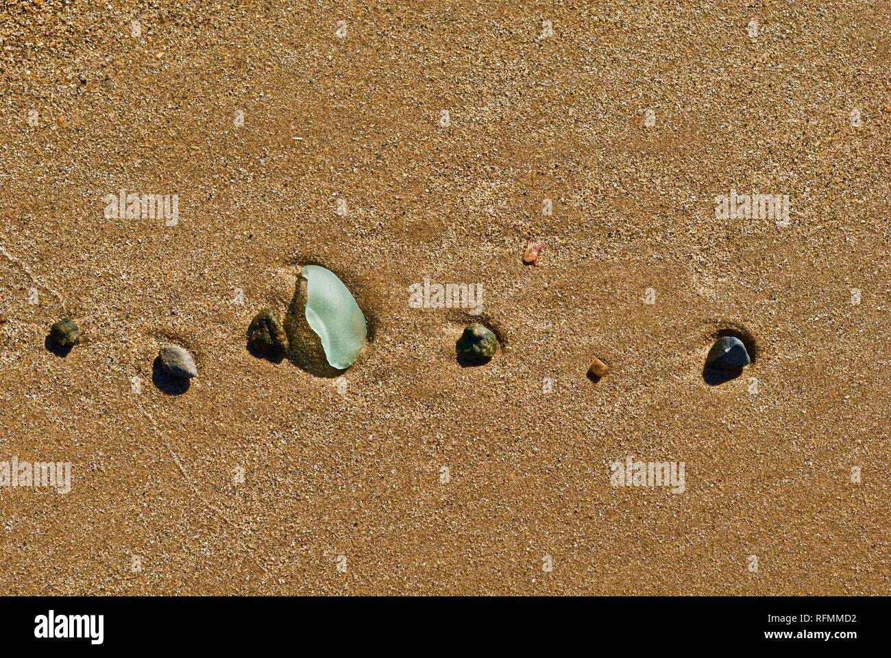 Sea glass waste and pollution washed up on a beach in Rhosneigr ...