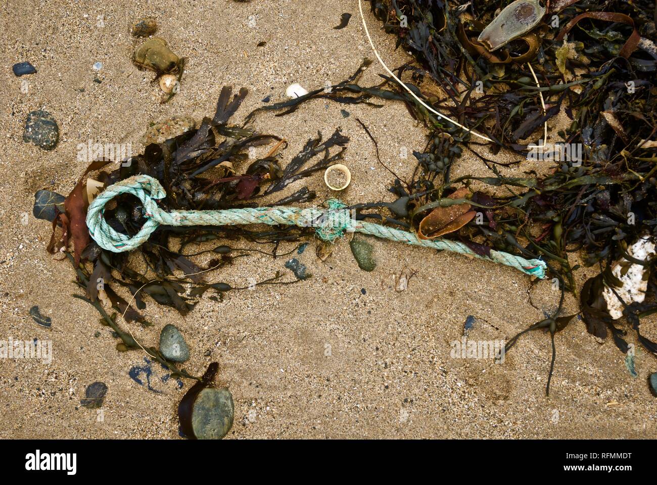 Plastic rope waste and pollution washed up on a beach in Rhosneigr ...