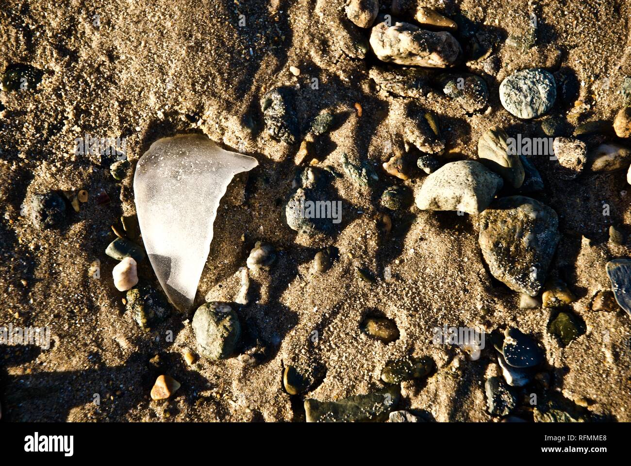 Sea glass waste and pollution washed up on a beach in Rhosneigr ...