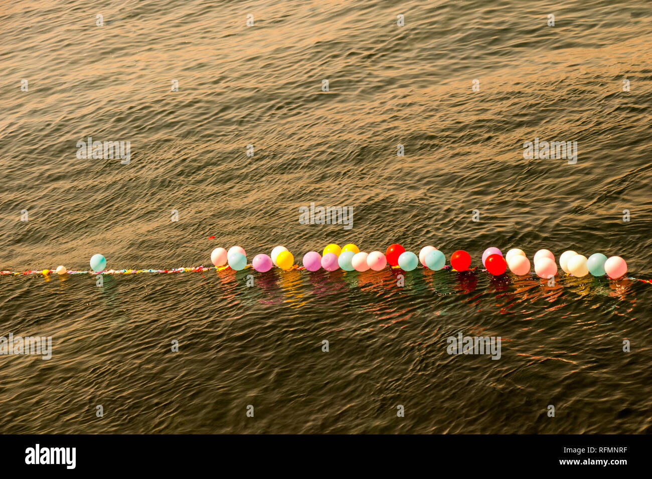 Balloons in shooting range as targets on water Stock Photo - Alamy
