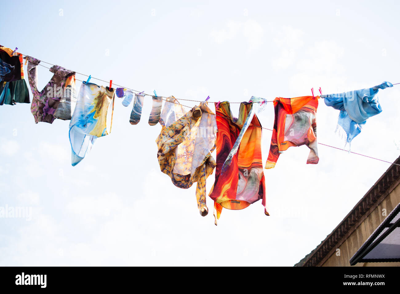 Clothes hanging from a clothesline hi-res stock photography and images ...