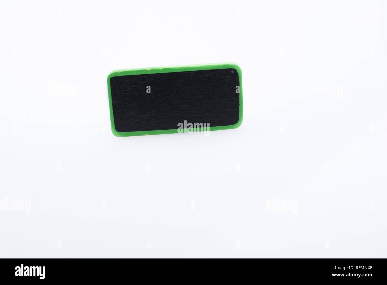 Small green sided black noticeboard on a white background Stock Photo ...