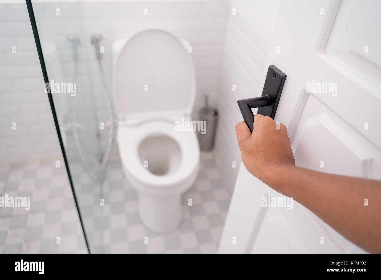 hand opening the toilet door Stock Photo - Alamy