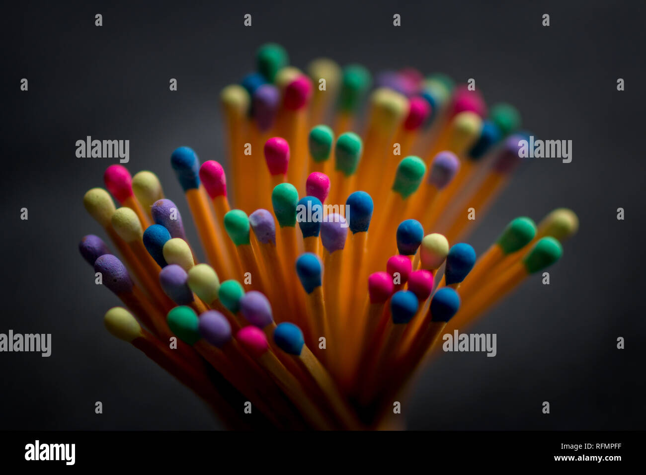 group of multicolored matches on black background Stock Photo - Alamy