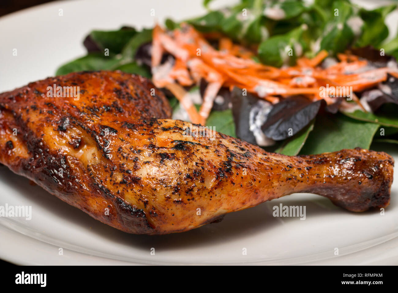 healthy lunch of grilled leg of chicken and salad Stock Photo - Alamy