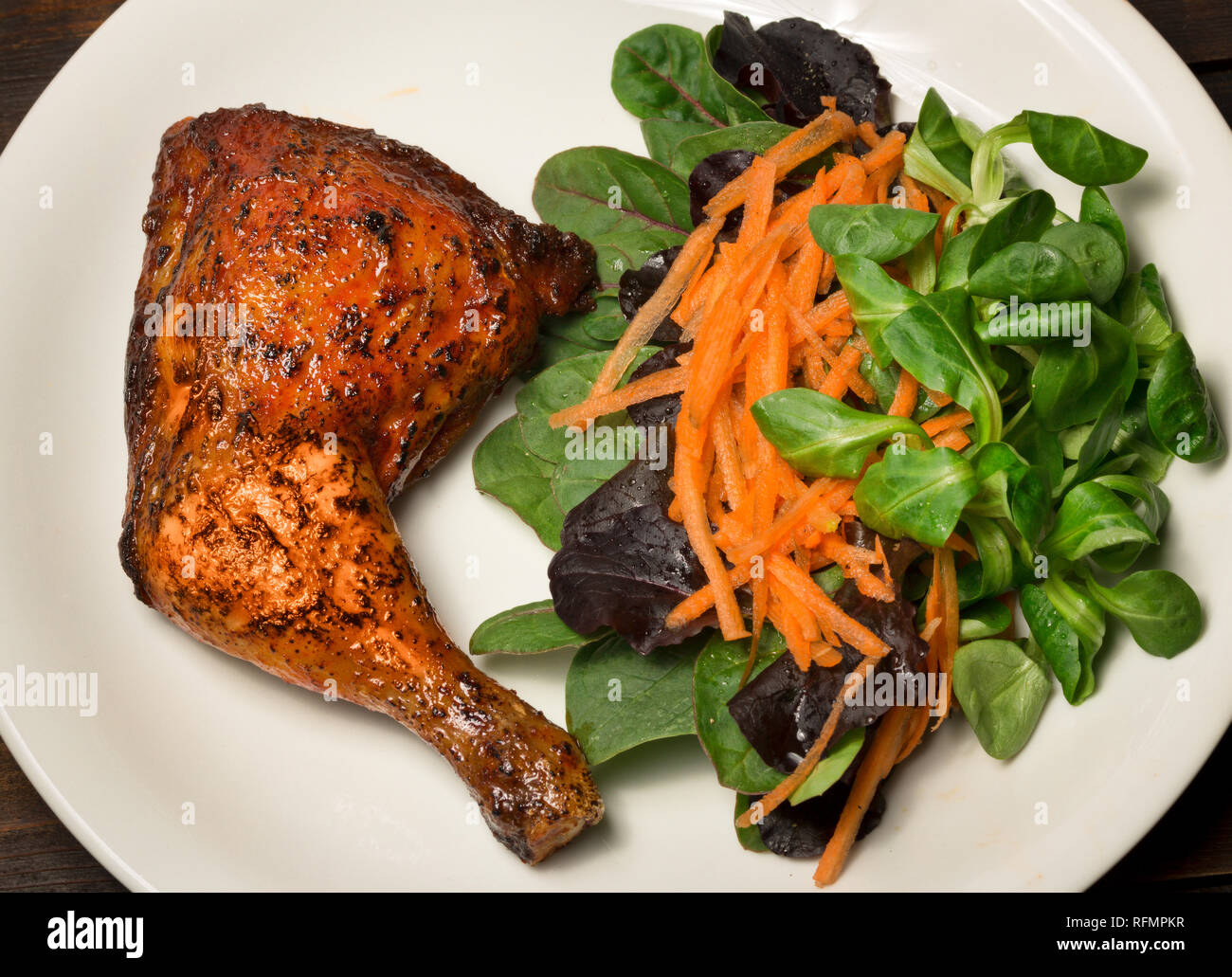 healthy lunch of grilled leg of chicken and salad Stock Photo - Alamy
