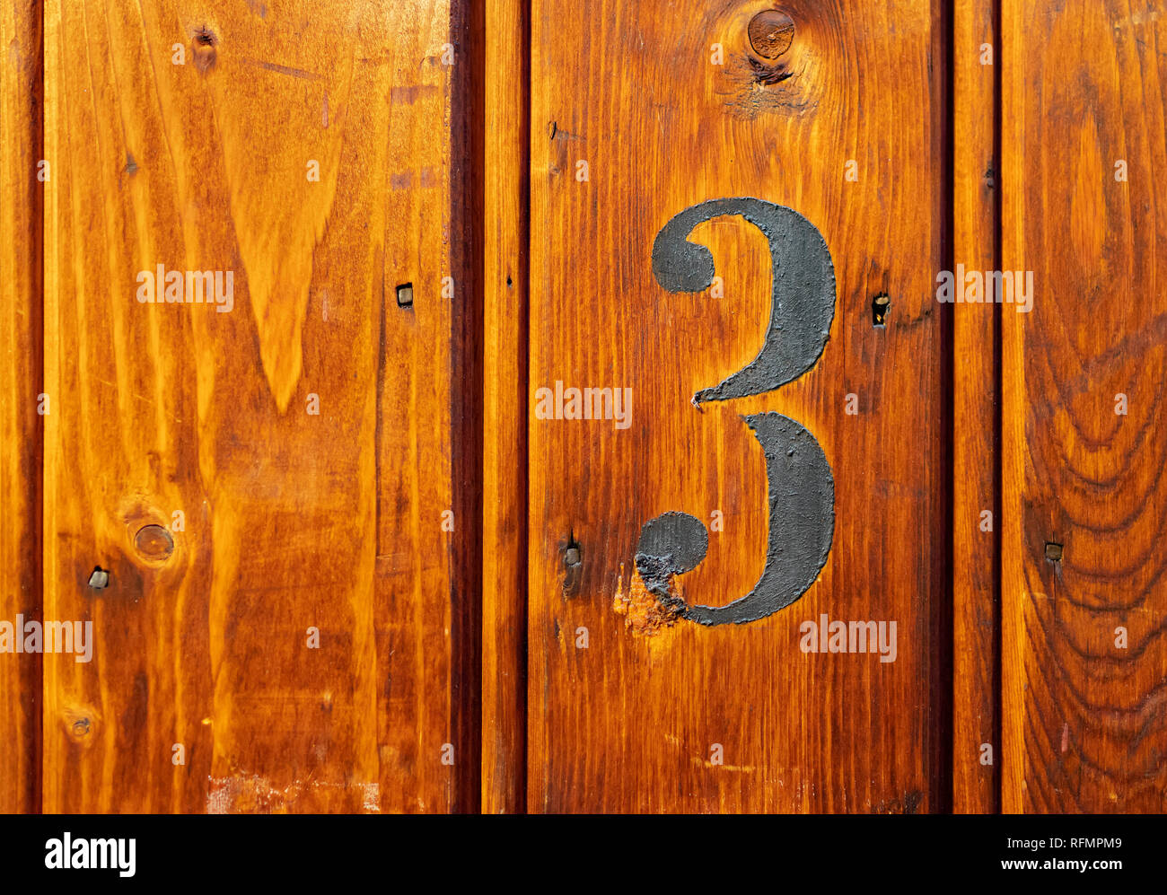 Number 3 On Door Of Storage Room For Tenants In Century old Apartment number-3-on-door-of-storage-room-for-tenants-in-century-old-apartment