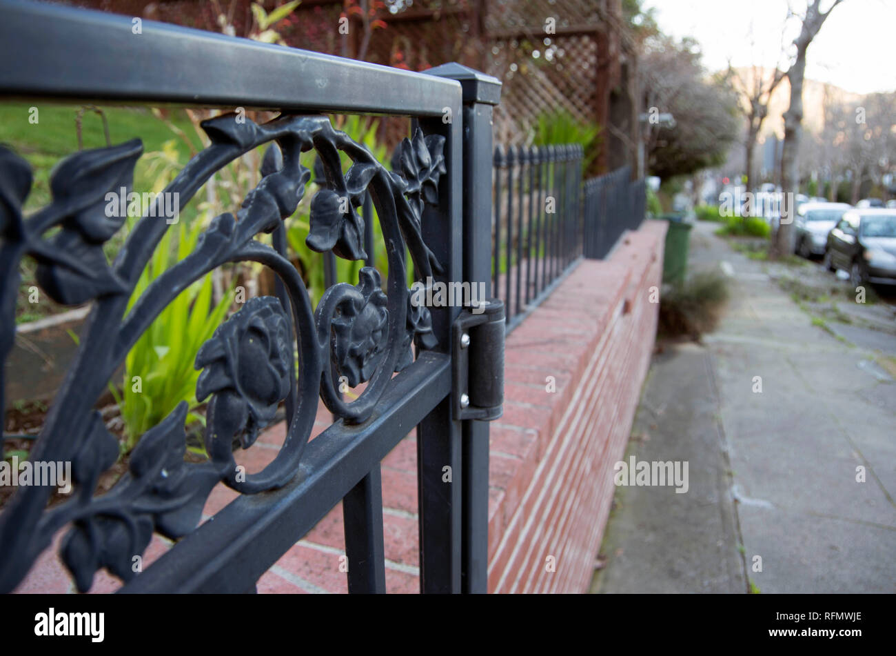 A decorative iron gate guards the front yard of a house in San Rafael ...