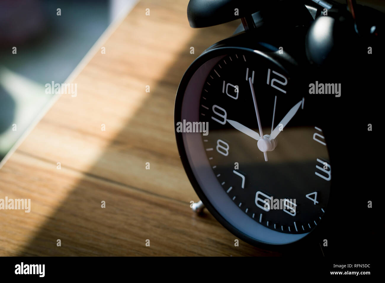 Black alarm clock Stock Photo - Alamy