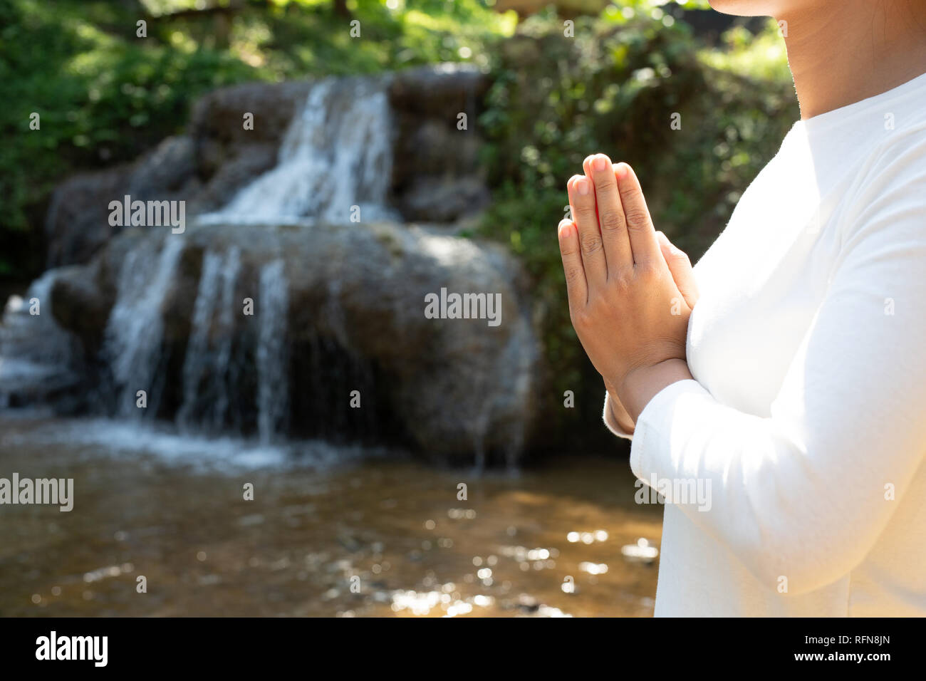 Beautiful girls are playing yoga at the park. Among the natural ...