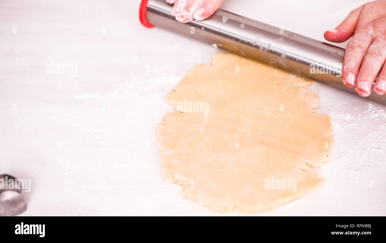 Step by step. Rolling sugar cookie dough with metal rolling pin Stock ...