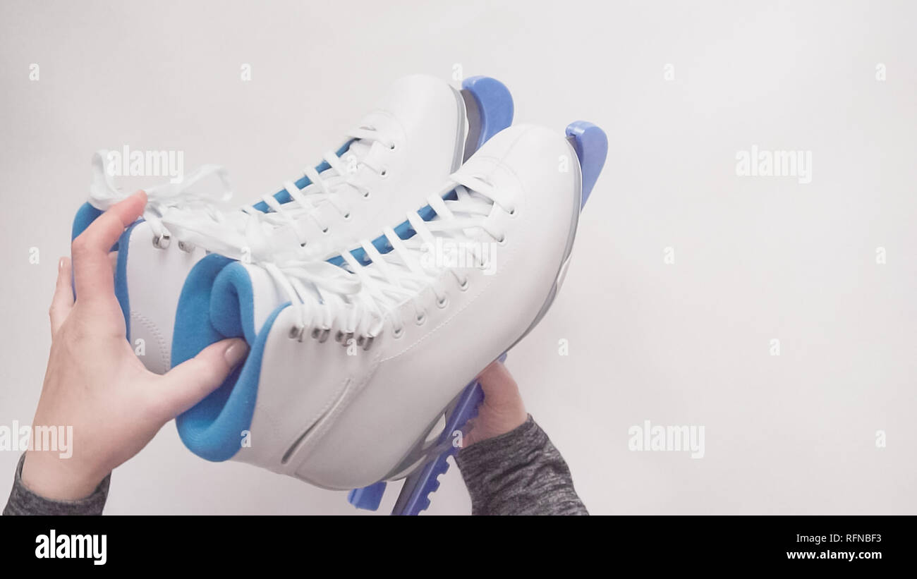 Flat lay. New figure skates on a white background Stock Photo - Alamy