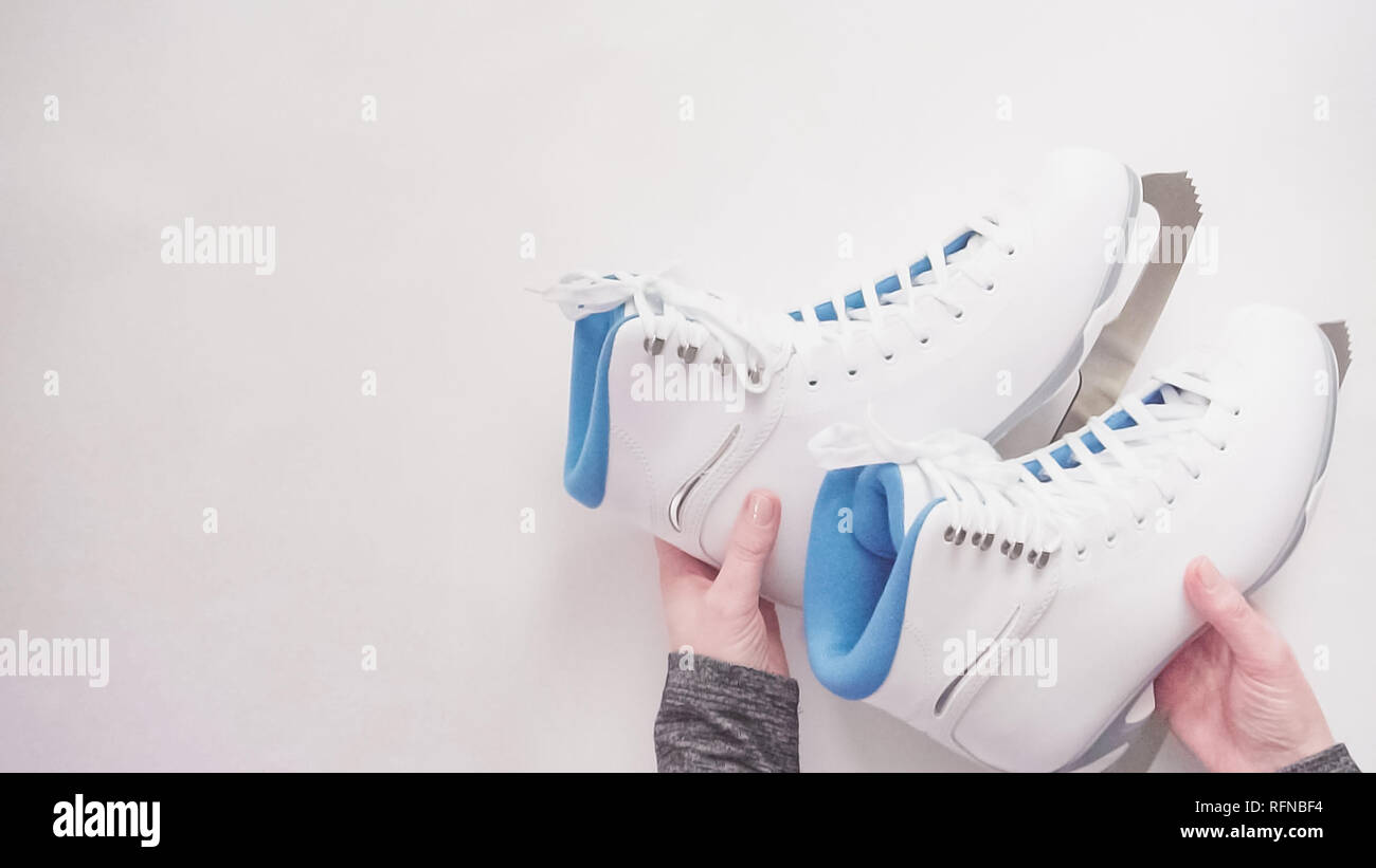 Flat lay. New figure skates on a white background Stock Photo - Alamy
