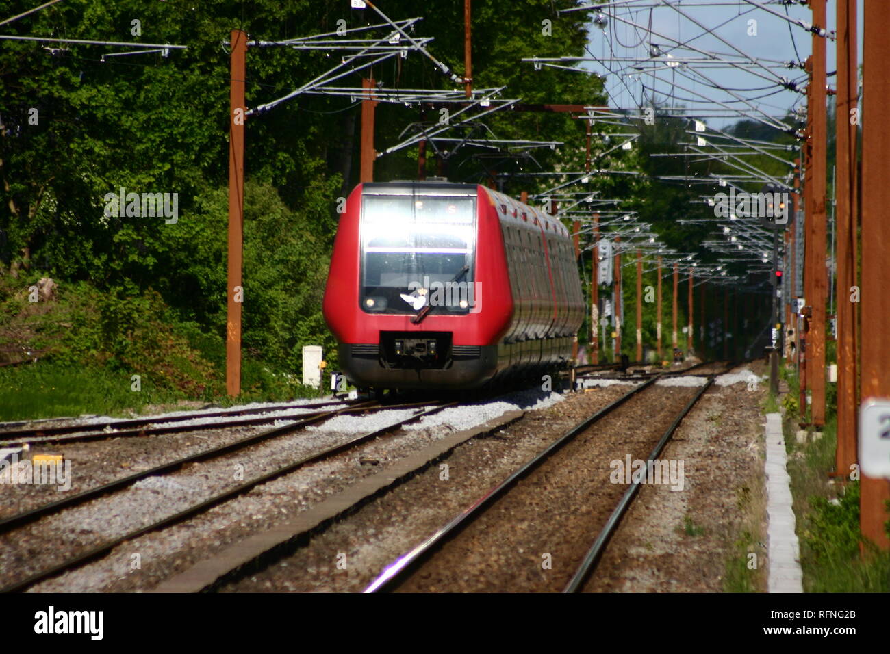 red train in the station Stock Photo - Alamy
