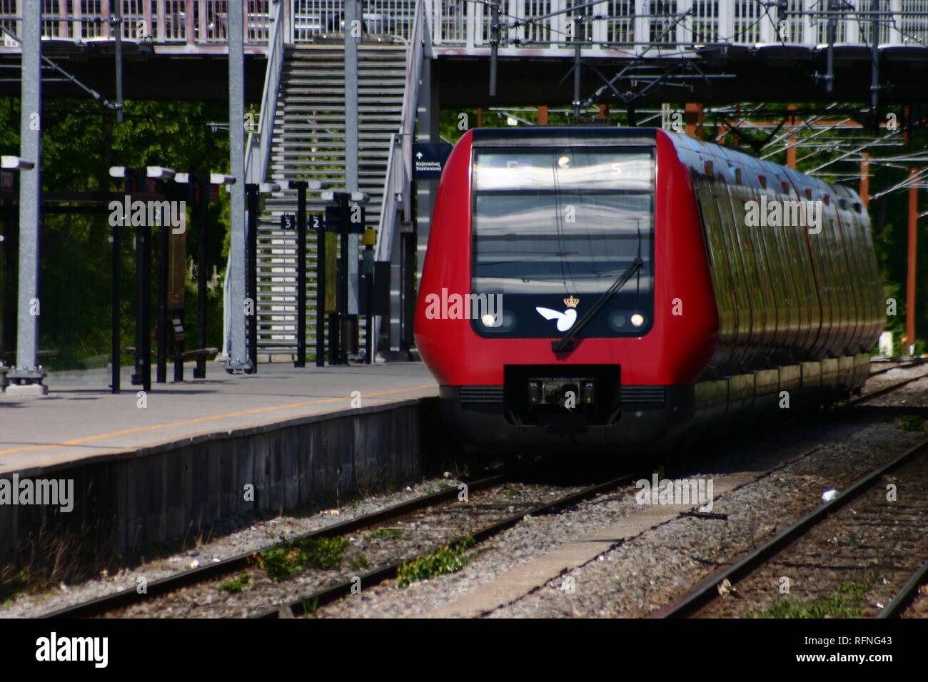 red train in the station Stock Photo - Alamy