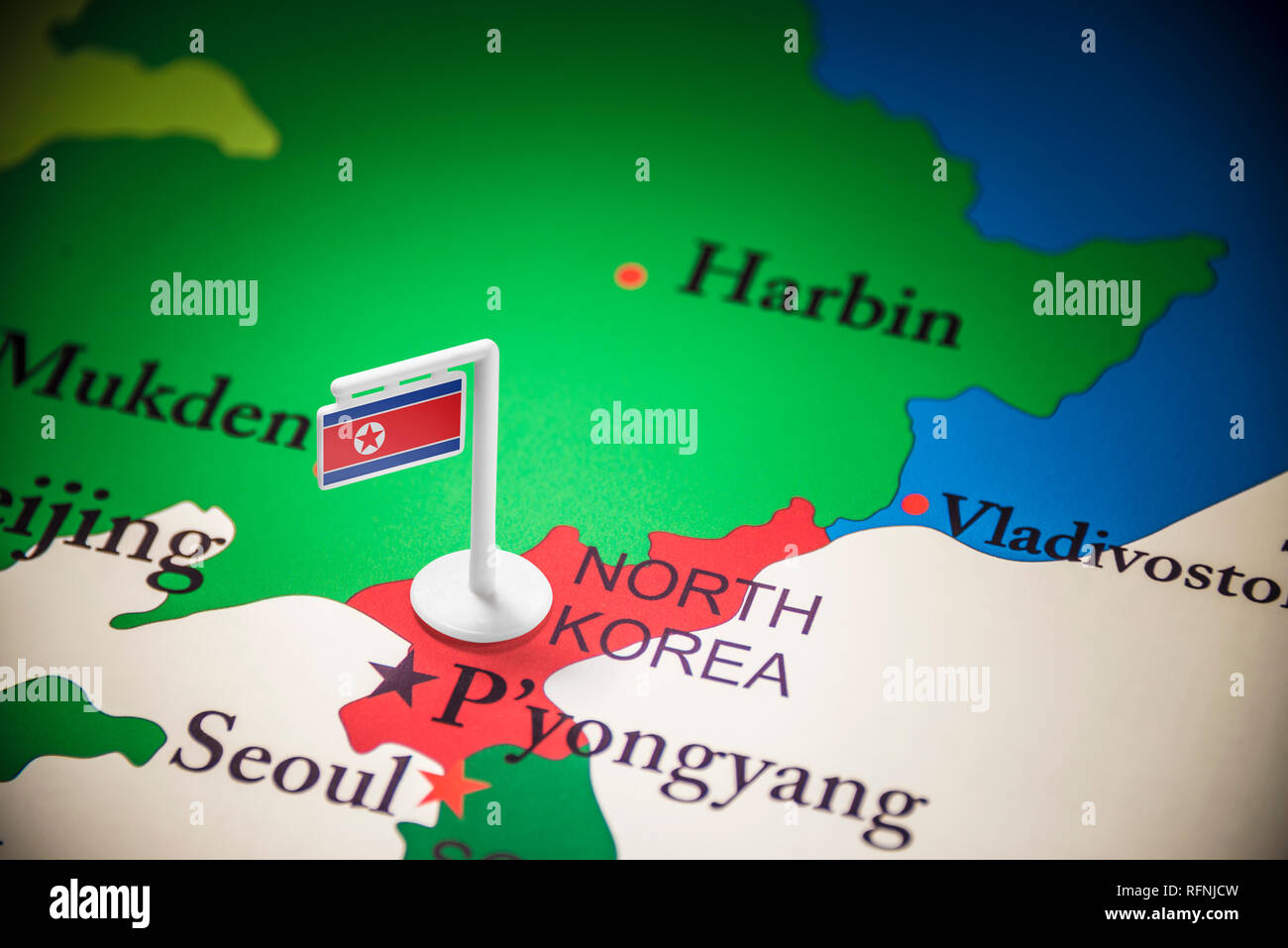 North Korea marked with a flag on the map Stock Photo - Alamy