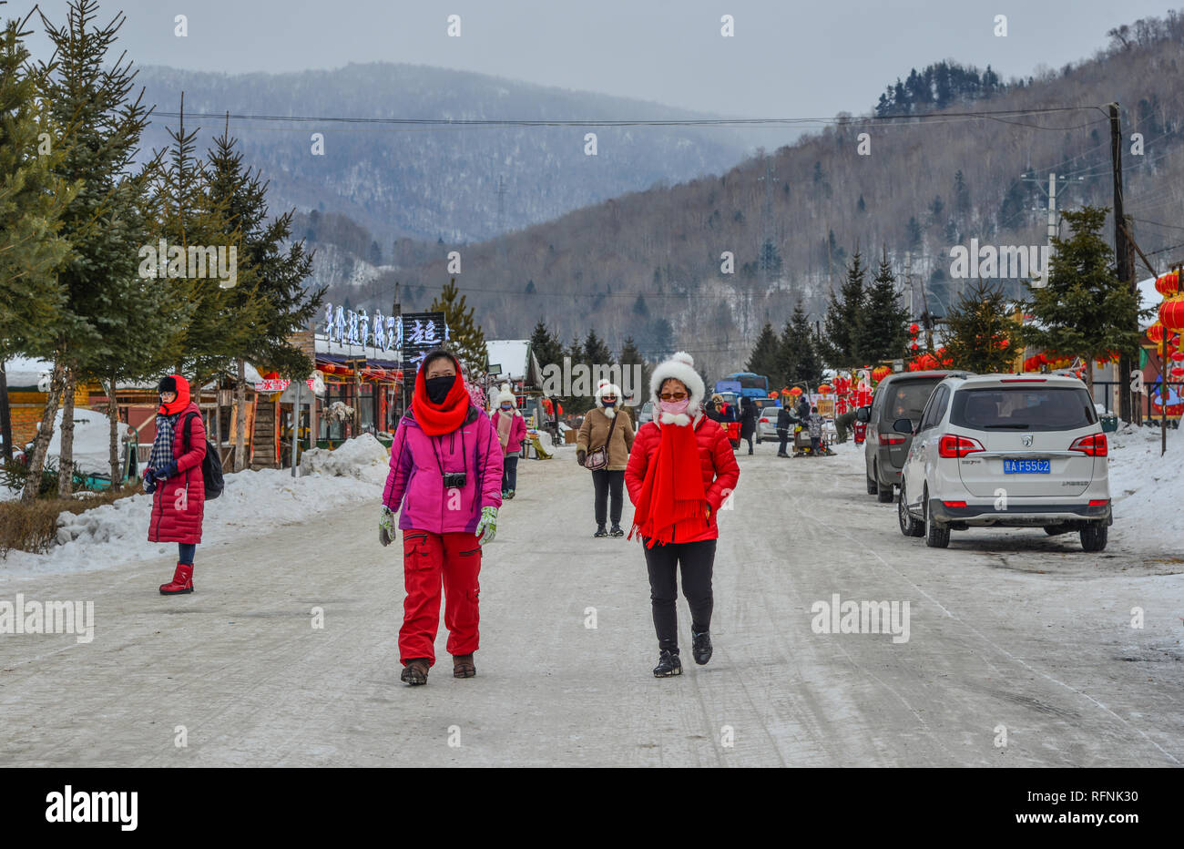 Harbin, China - Feb 24, 2018. People walking on main street of mountain ...