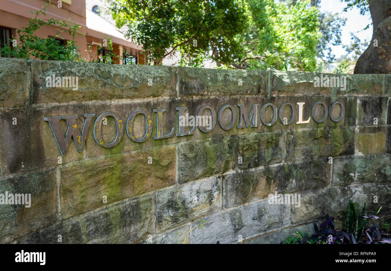 Woolloomooloo neighbourhood entrance sign with name written on a wall ...