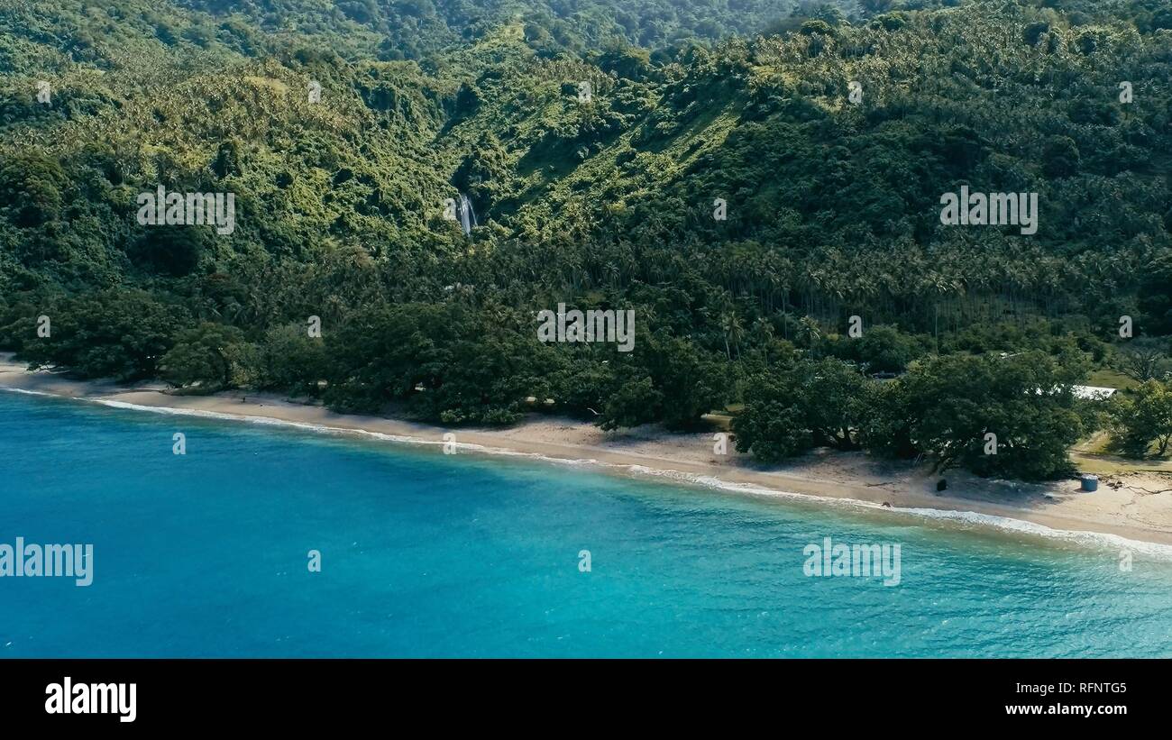 aerial drone image of a south pacific village on a remote island with ...