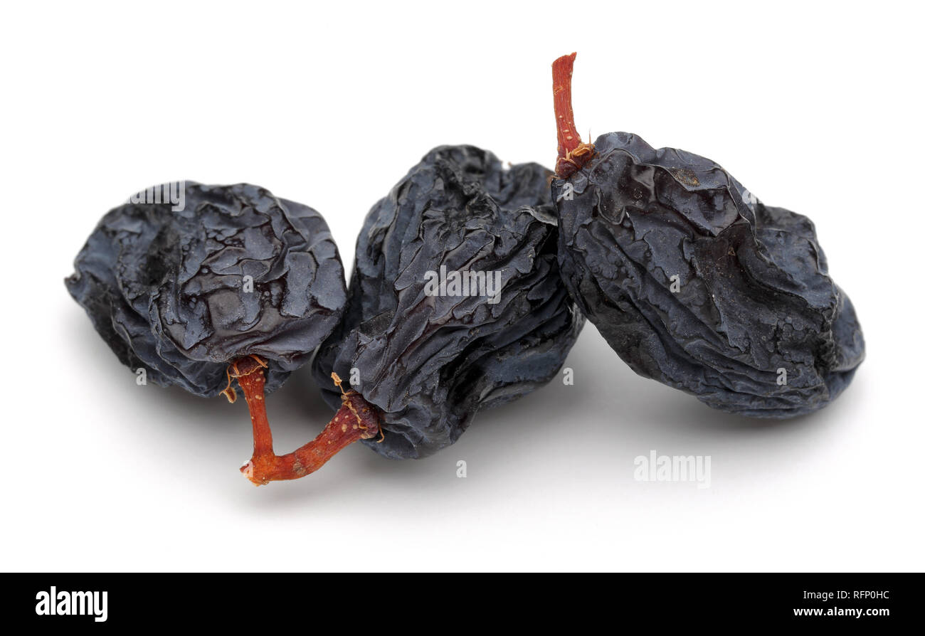 Black raisins isolated on white background Stock Photo - Alamy