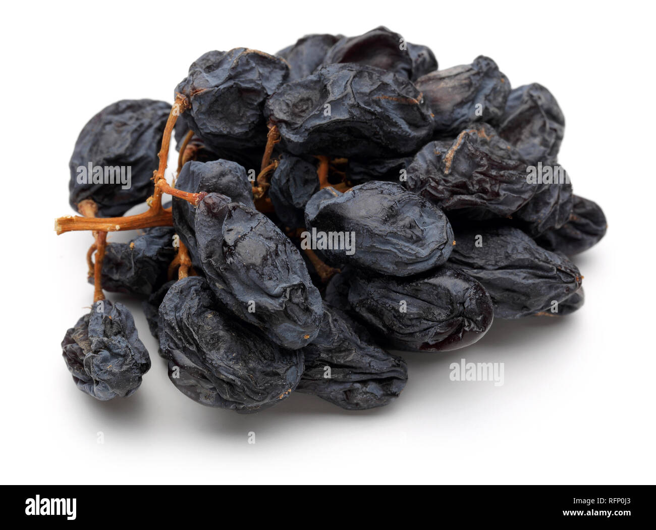Black raisins isolated on white background Stock Photo - Alamy