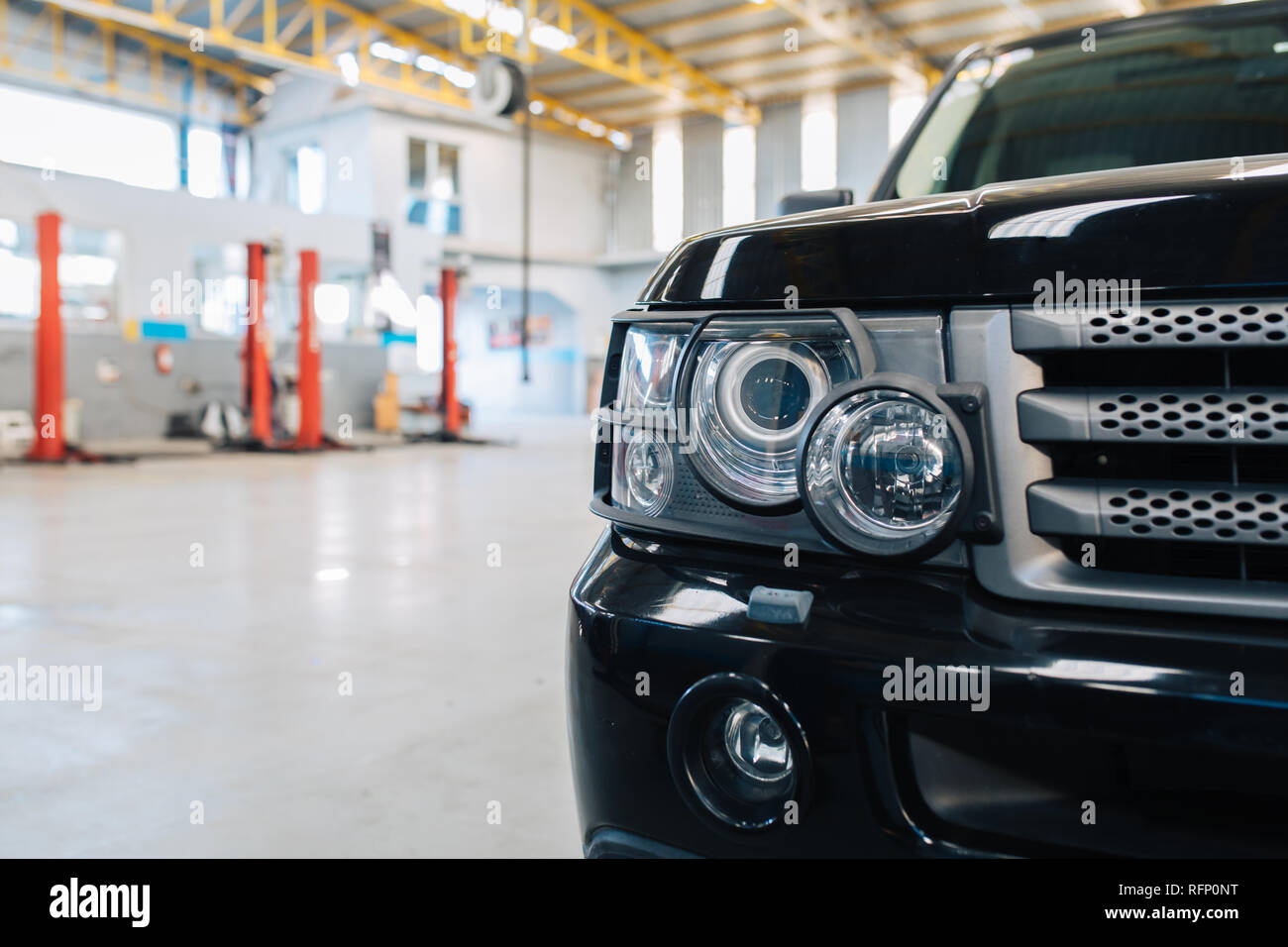 Modern Cars in repair maintenance auto service garage Stock Photo - Alamy