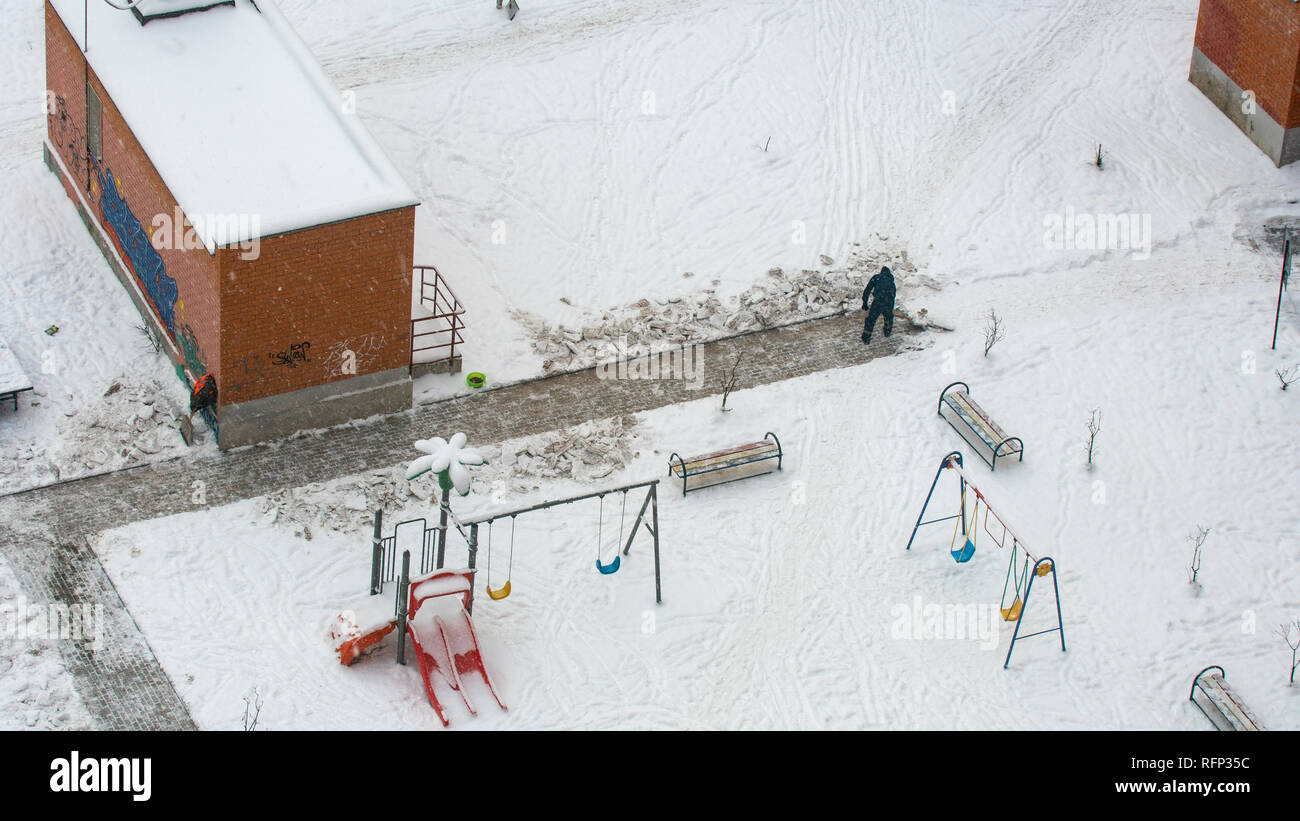 Men shoveling snow view from above Stock Photo - Alamy