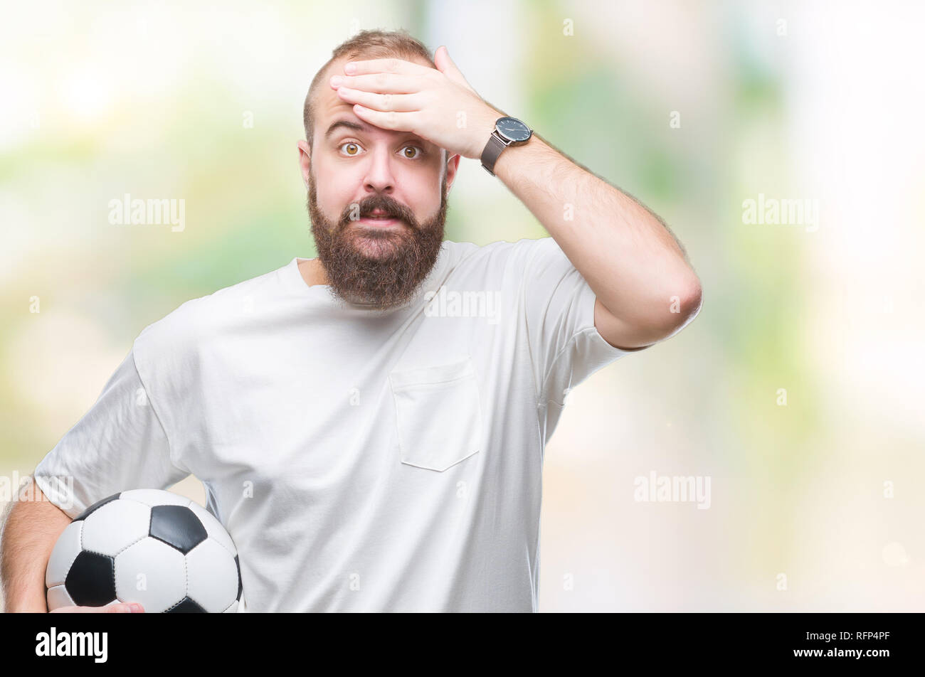 Young caucasian hipster man holding soccer football ball over isolated ...