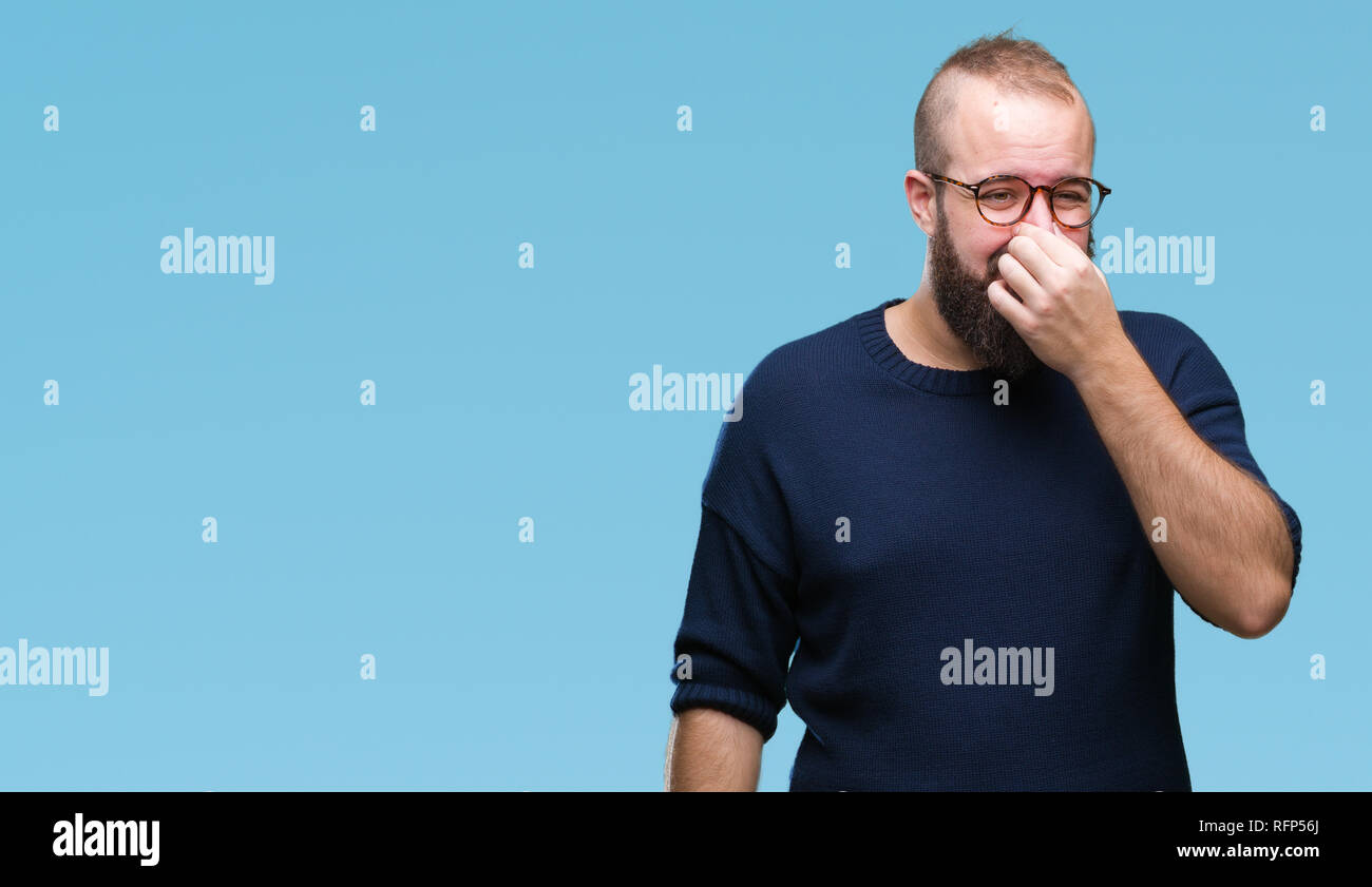Young caucasian hipster man wearing sunglasses over isolated background ...