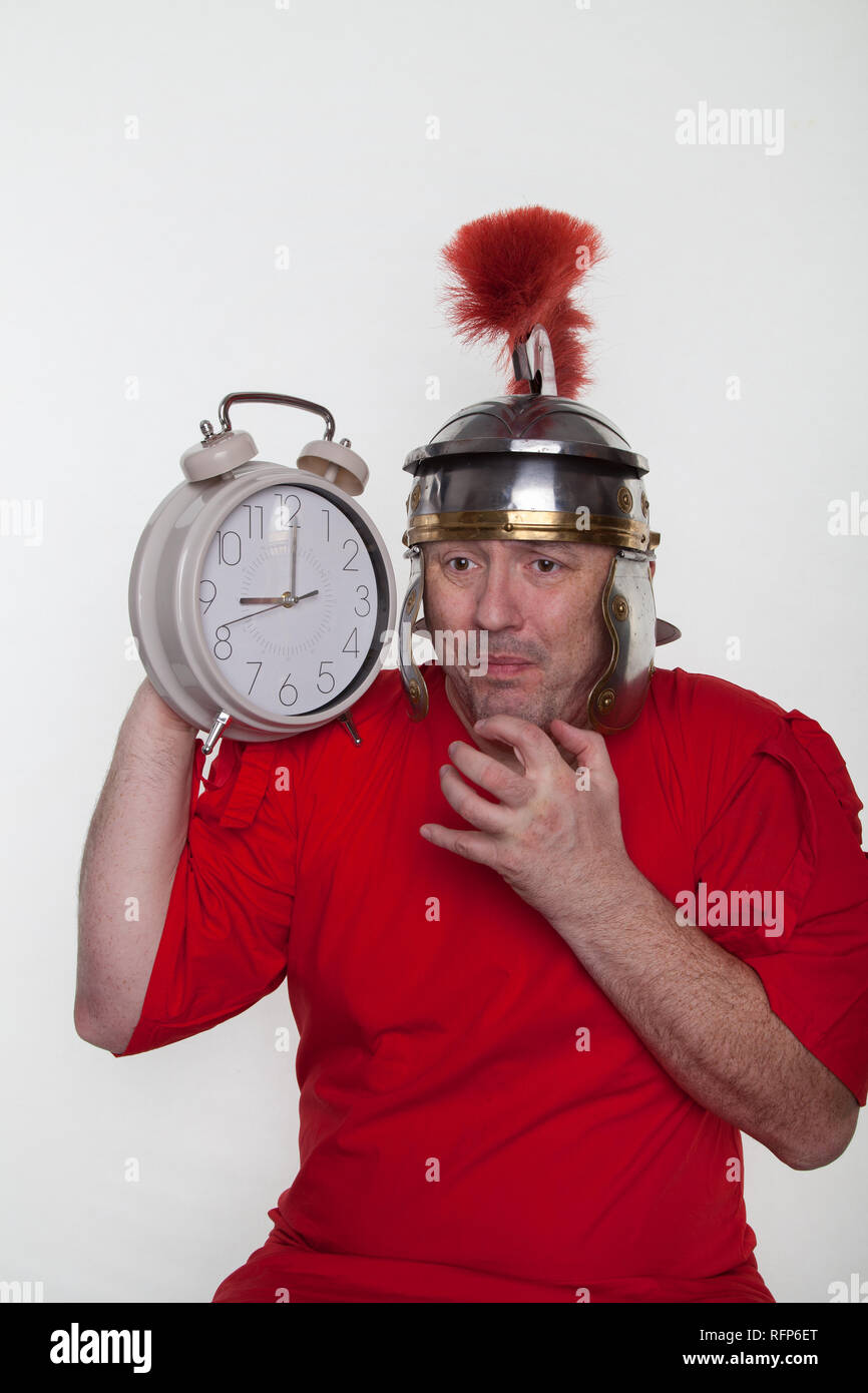 A roman soldier with a big alarm clock on the white background Stock ...
