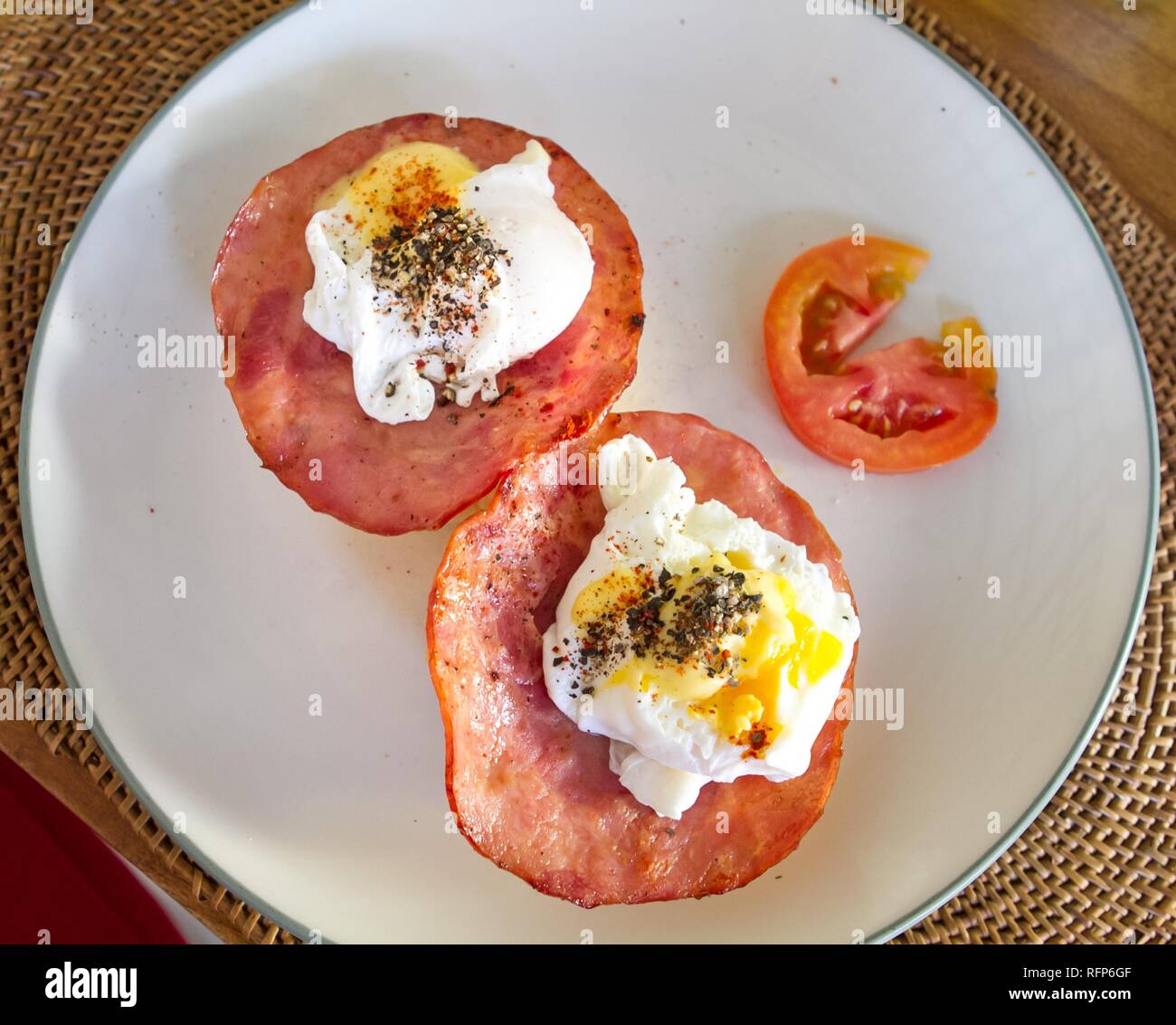 Breakfast with poached eggs and ham Stock Photo - Alamy