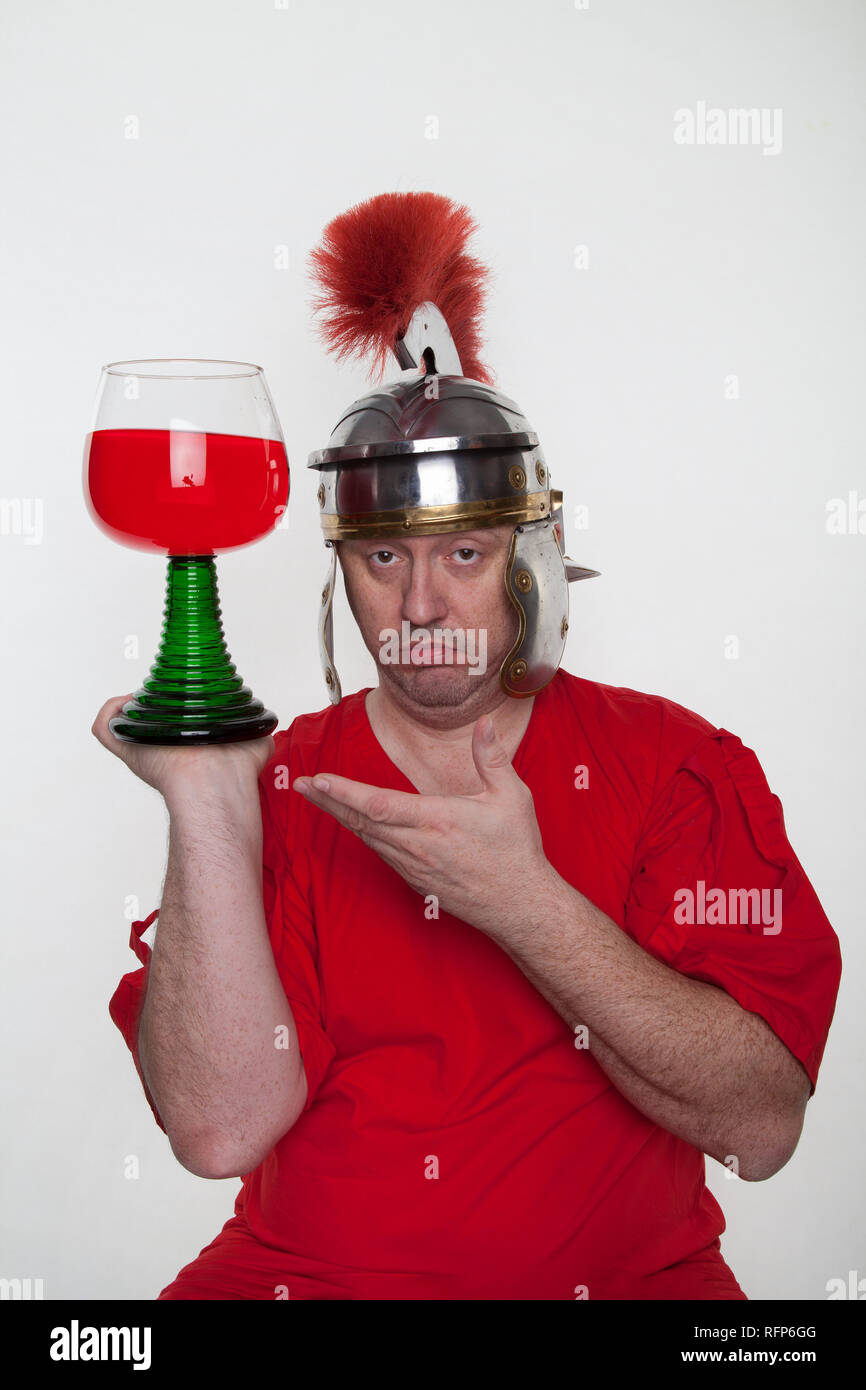 A roman soldier drunk with a glass of wine on the white background ...