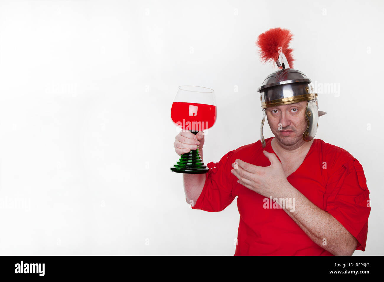 A roman soldier drunk with a glass of wine on the white background ...