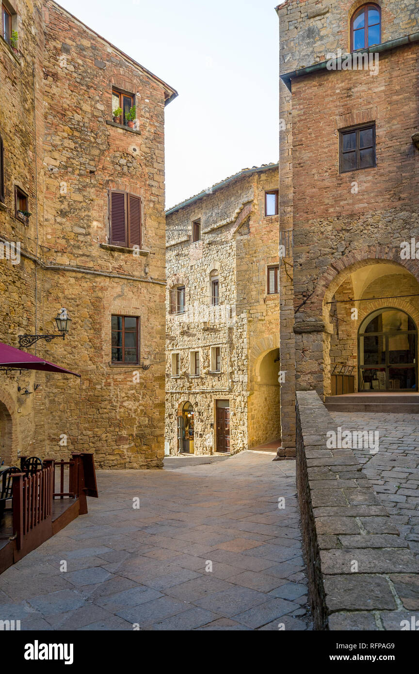 Volterra old town street vertical photo with historic buildings ...