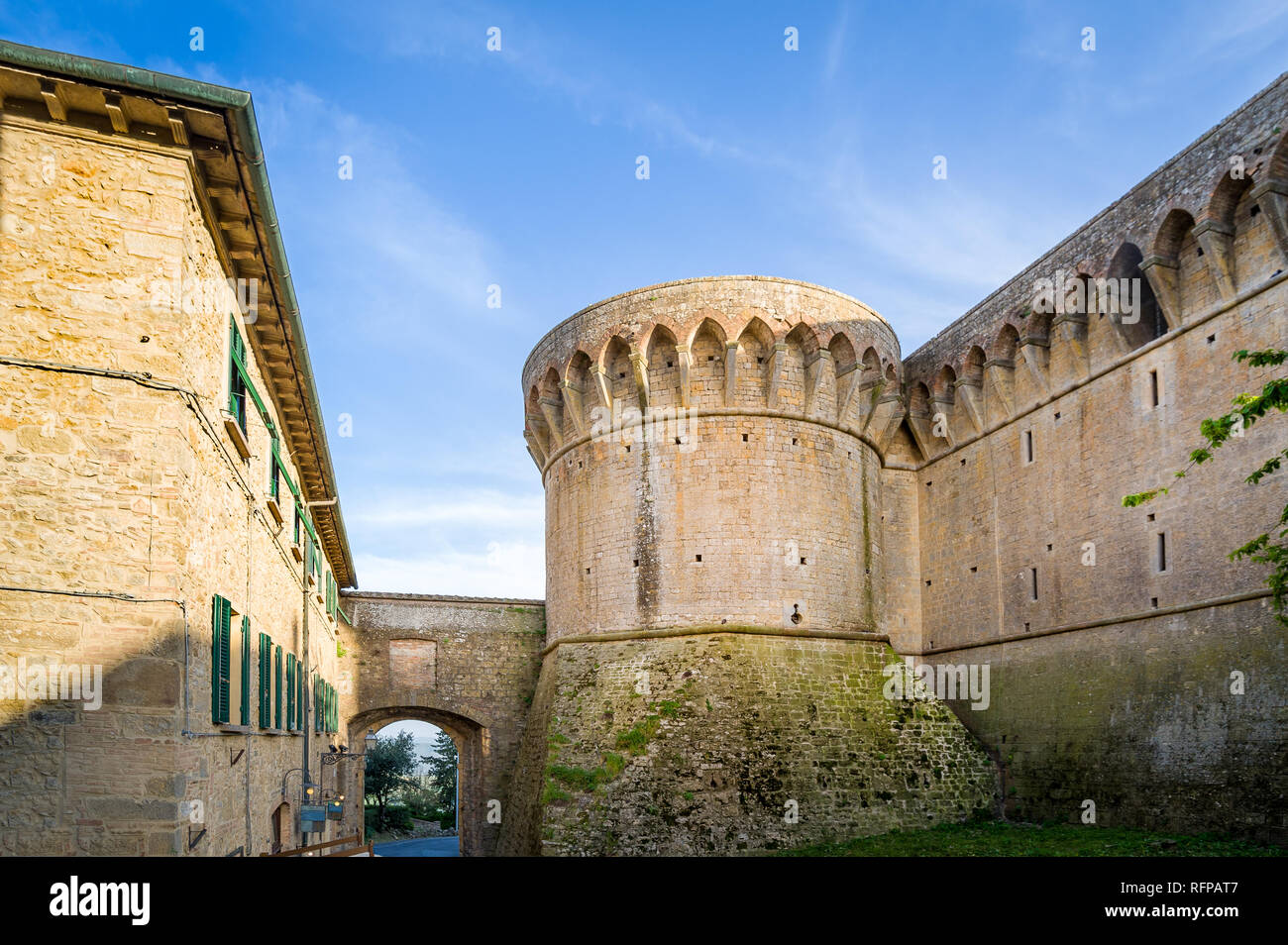 Volterra old fortress gate and tower at evening shade. Toscana historic ...