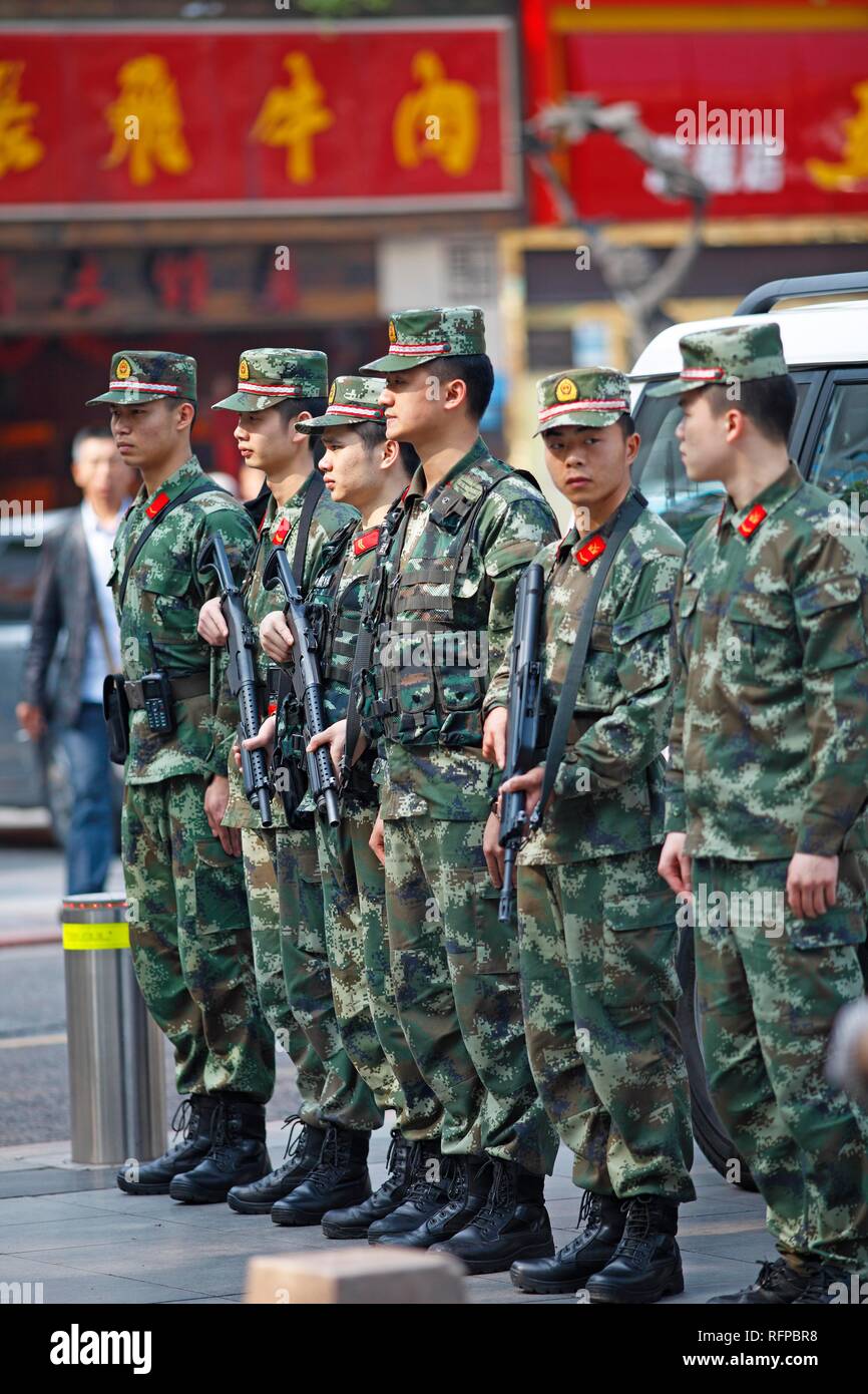Armed soldiers stand guardrails at the People's Square, Chongqing ...