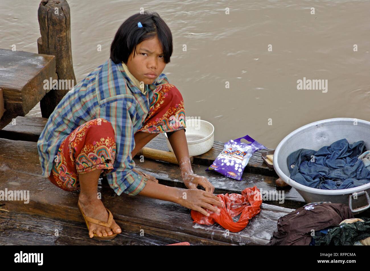 Child washing clothes, Myanmar, Burma Stock Photo - Alamy