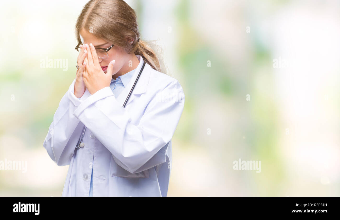 Beautiful young blonde doctor woman wearing medical uniform over ...