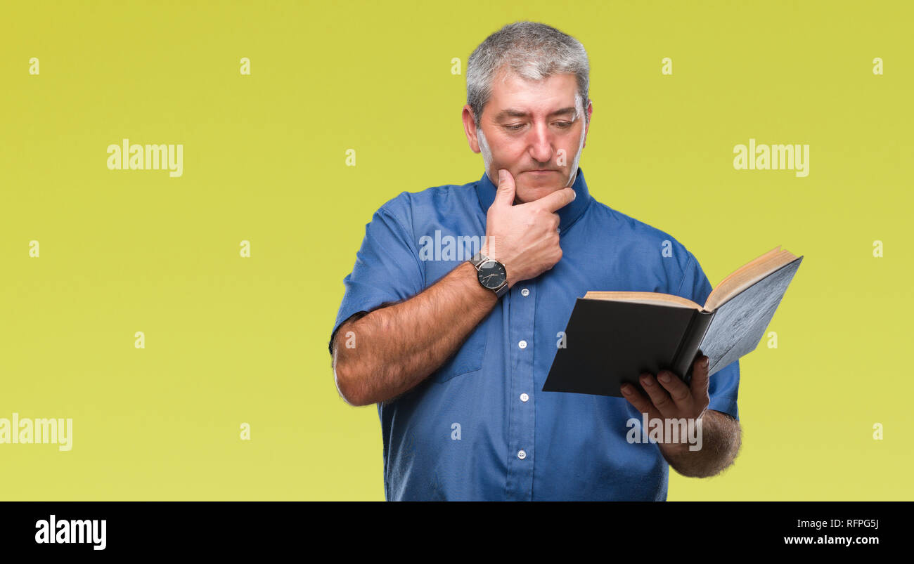 Confused man reading book hi-res stock photography and images - Alamy