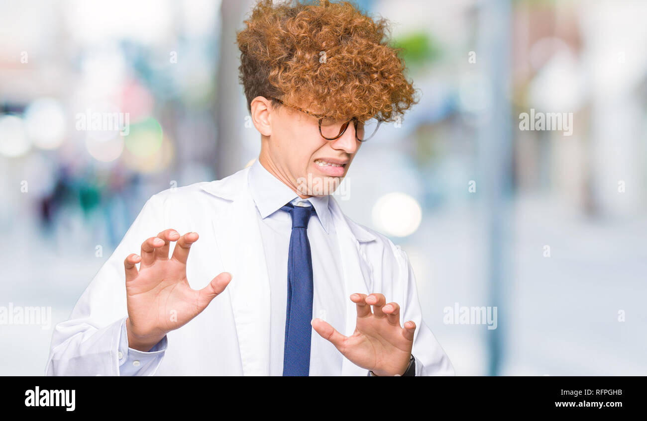Young handsome scientist man wearing glasses disgusted expression ...