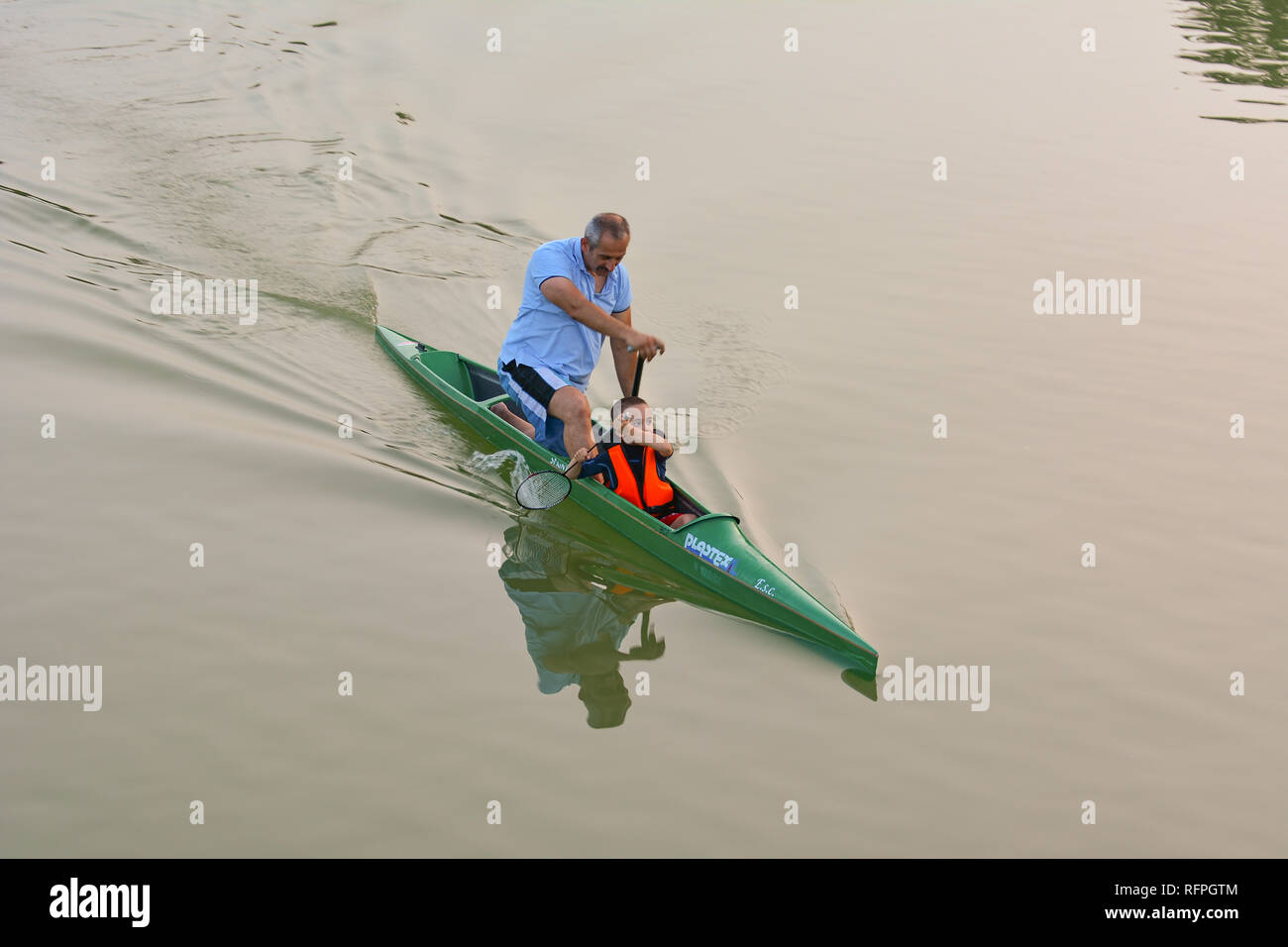 father and son rowing in boat, Plovdiv city - rowing channel, Bulgaria ...