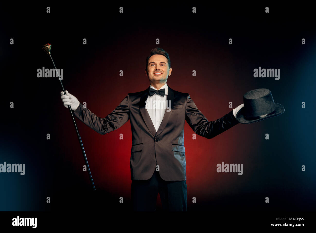 Professional Occupation. Showman in suit standing isolated on wall with ...