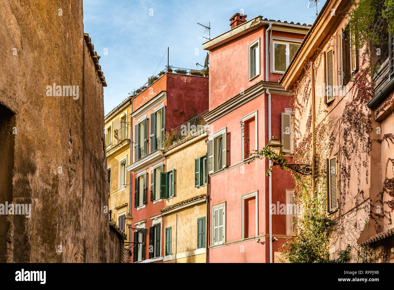 typical ancient buildings in fascinating street of Rome Stock Photo - Alamy
