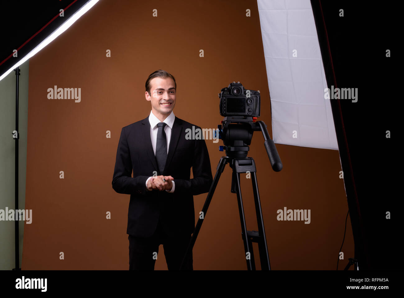 Portrait of young Caucasian businessman influencer vlogging Stock Photo ...