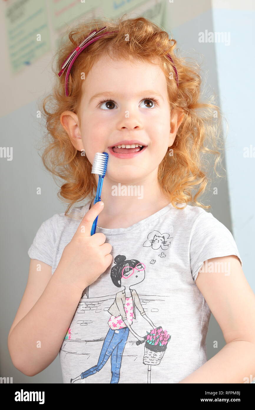 Happy Girl with toothbrush Stock Photo - Alamy