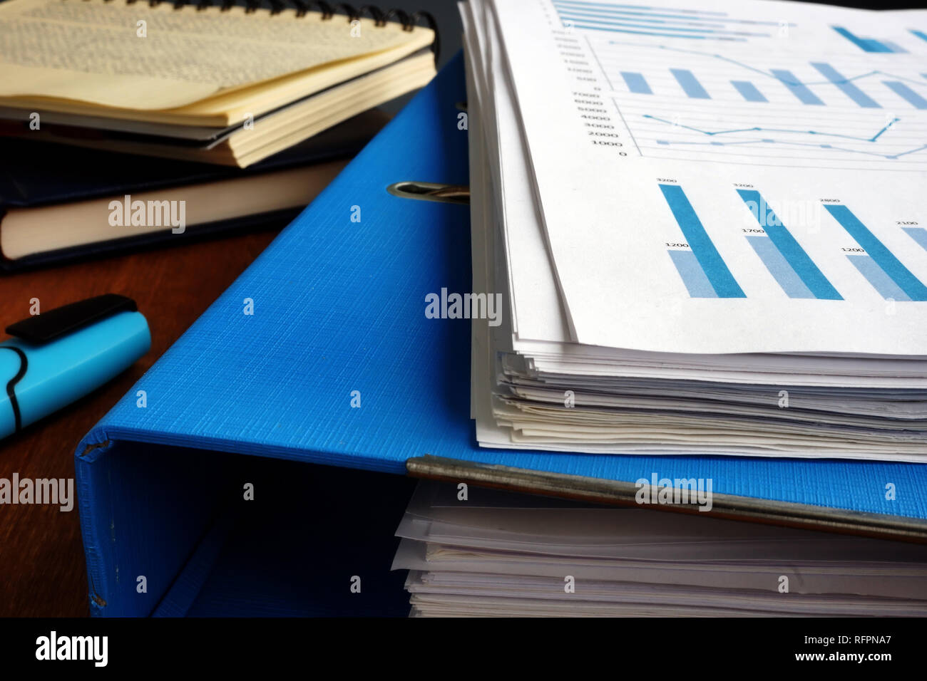 Stack of business papers and folder. Office desk with pile of documents ...