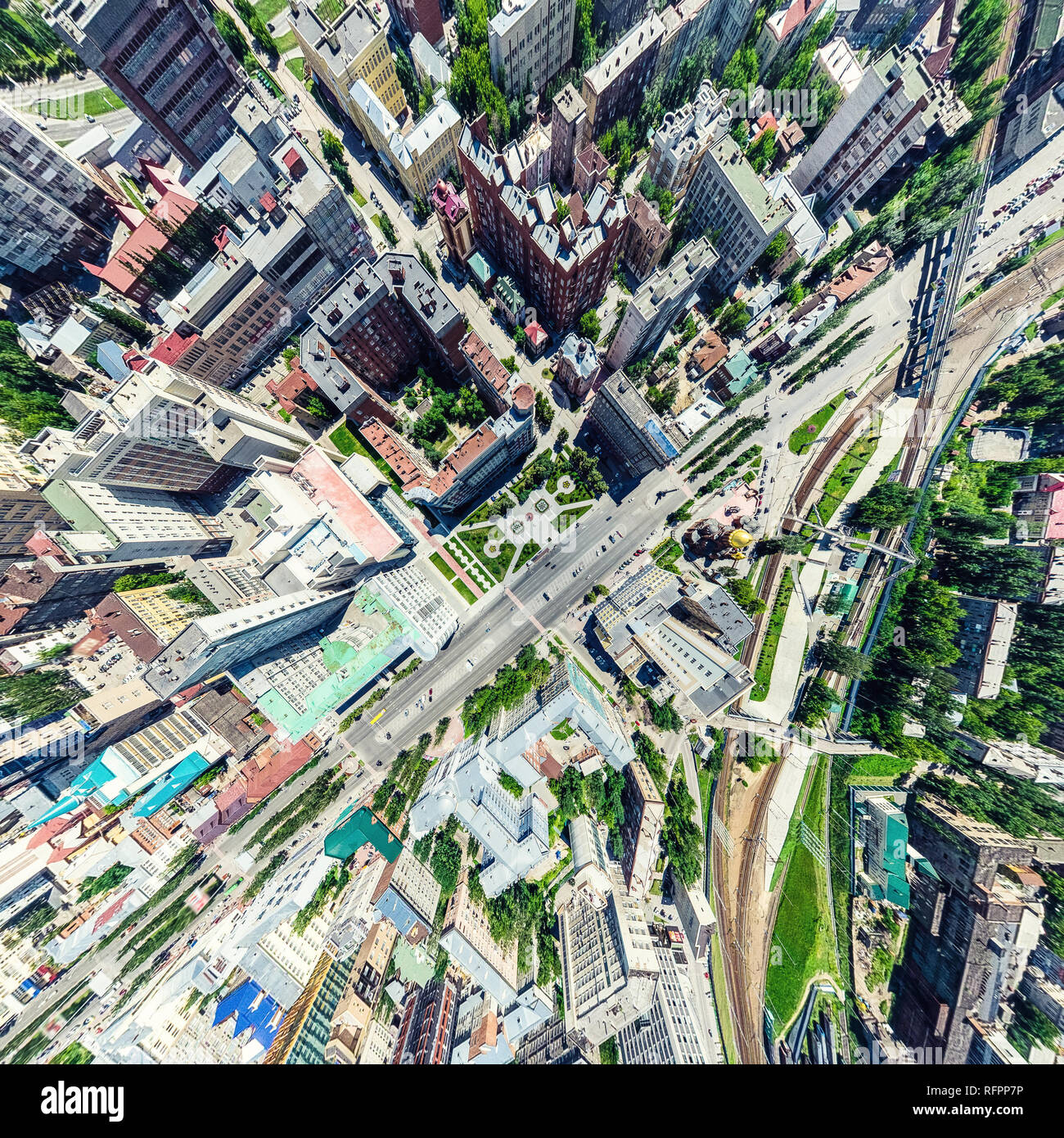 Aerial city view with crossroads and roads, houses, buildings, parks ...