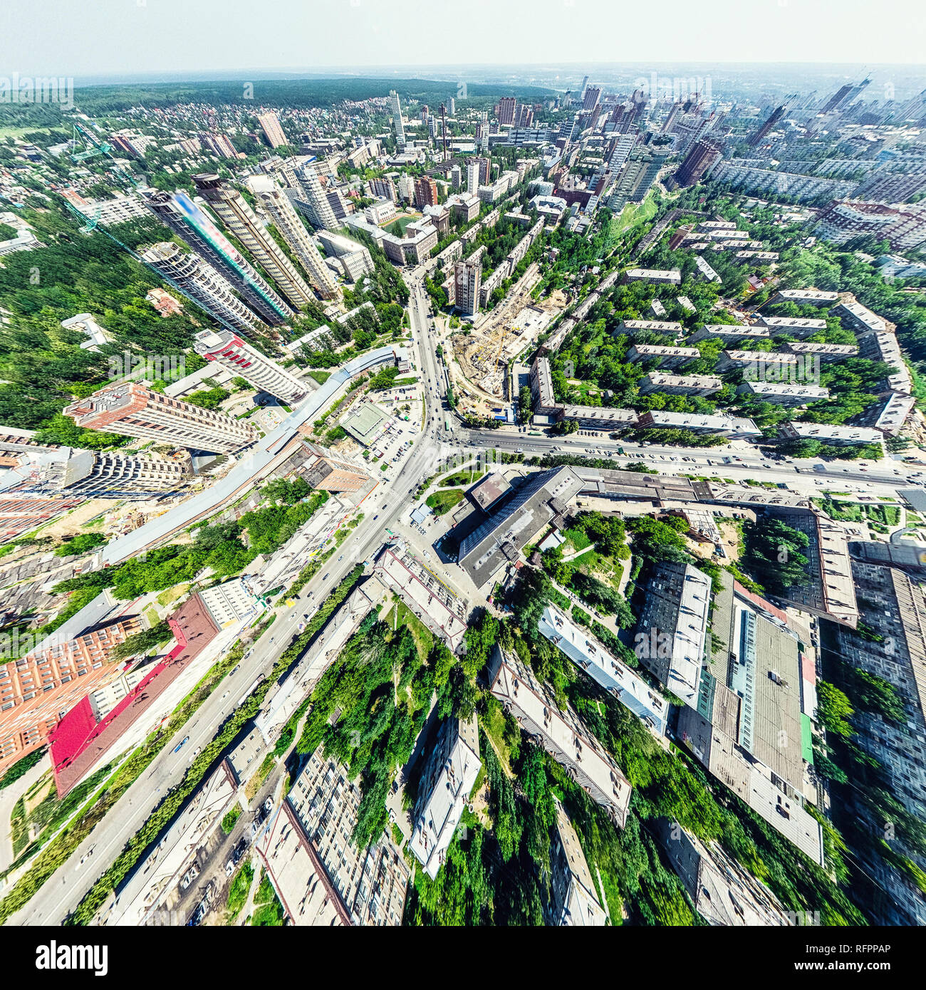 Aerial city view with crossroads and roads, houses, buildings, parks ...