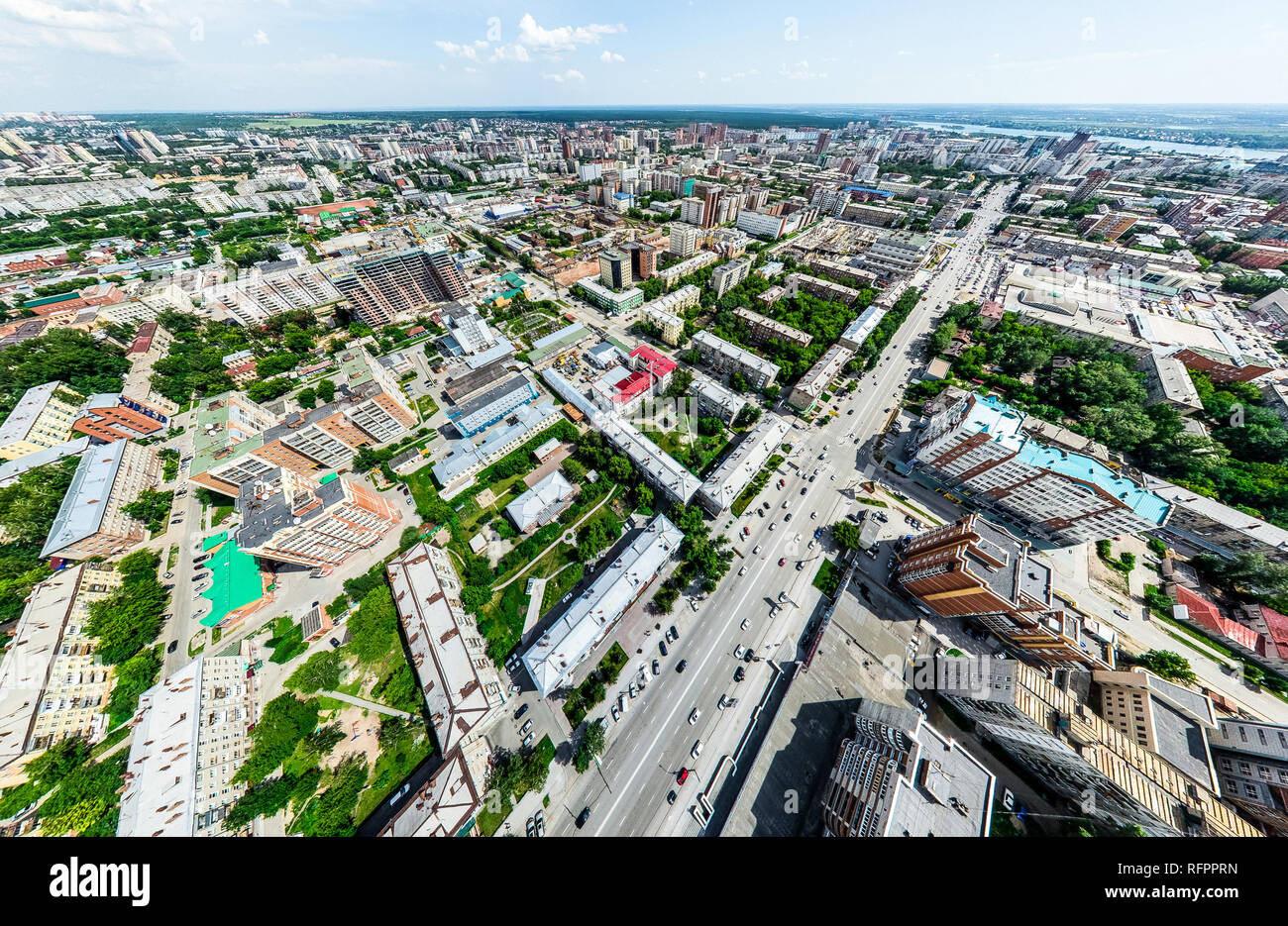 Aerial city view with crossroads and roads, houses, buildings, parks ...