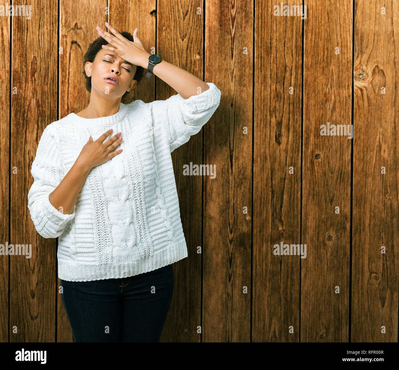 Beautiful young african american woman wearing sweater over isolated ...